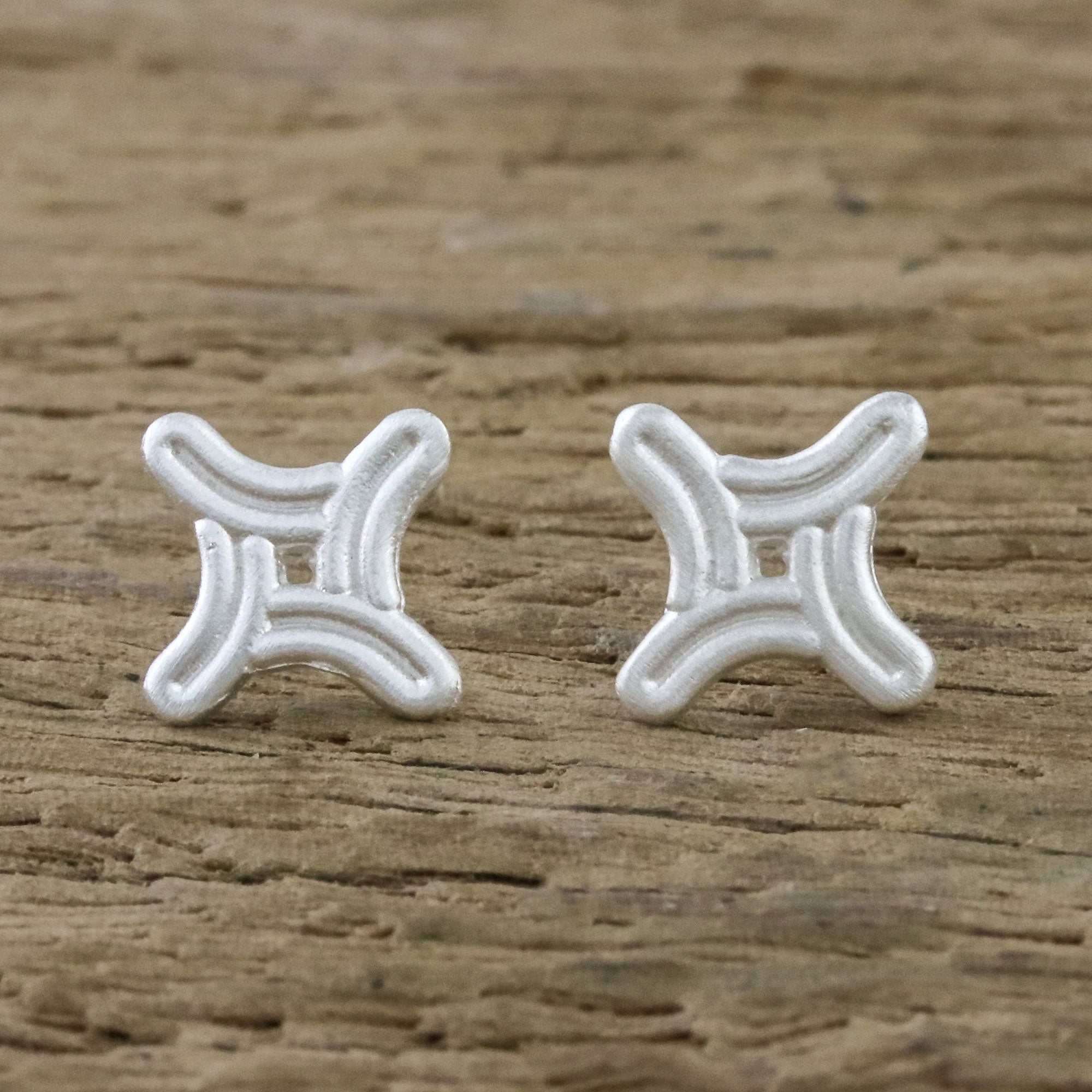 NOVICA Winking Star Curved Four-Sided Star Sterling Silver Stud ...